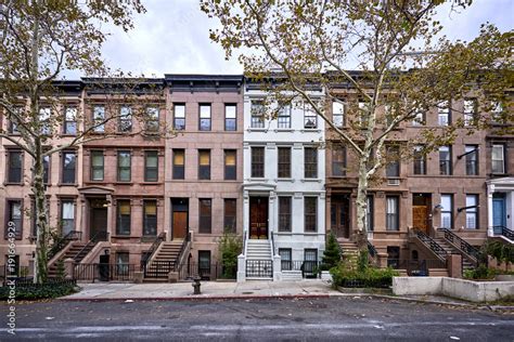 A View Of A Row Of Historic Brownstone Buildings In An Iconic