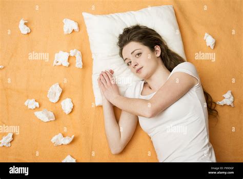 Sick Woman Lying In Bed With Sore Throat She Has Cold And Flu Stock