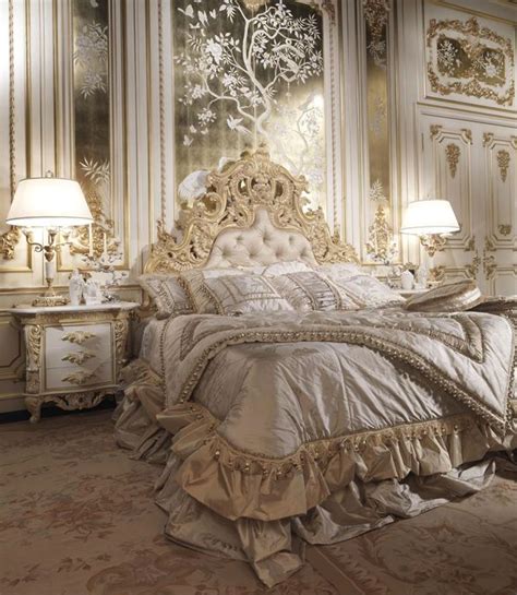 A Fancy Bedroom With Gold And White Decor