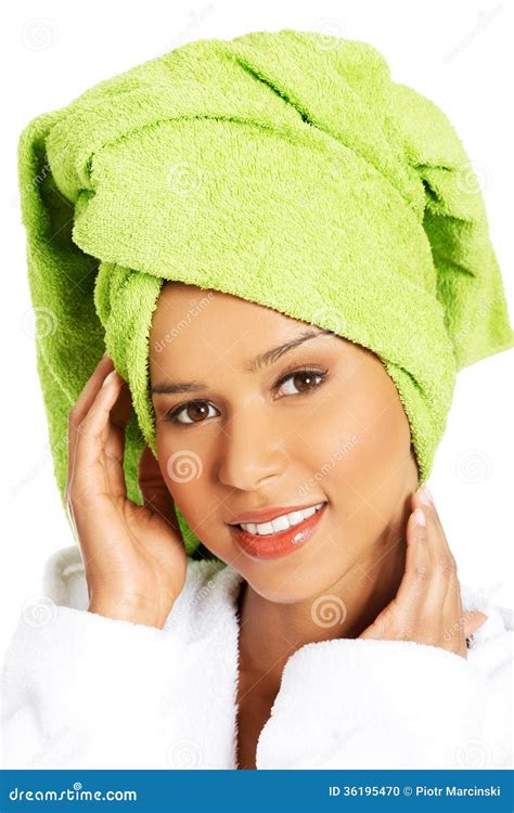 Portrait Of Attractive Smiling Woman Wrapped In Towel With Turban