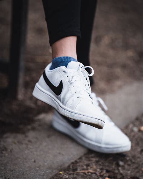 A Close Up Of Feet Wearing Blue Shoes Photo Free Shoe Image On Unsplash