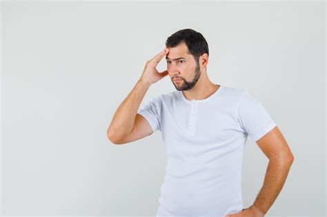 Free Photo Young Man Holding Hand On His Forehead In T Shirt And