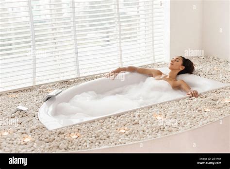 Relaxation And Wellness Full Length Of Pretty Young Woman Taking Foamy
