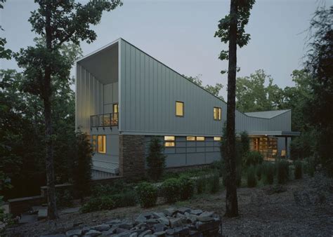 bowtie house by demx architecture has an angular metal roof