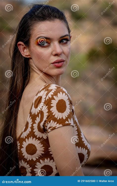 A Lovely Brunette Model Poses Outdoors While Enjoying The Fall Weather