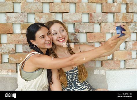 Ukrainian Woman Brunette And Russian Woman Blonde Portrait Together