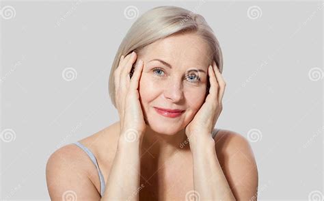 Fifty Year Old Woman Is Very Pleased With Her Well Groomed Face Relaxed