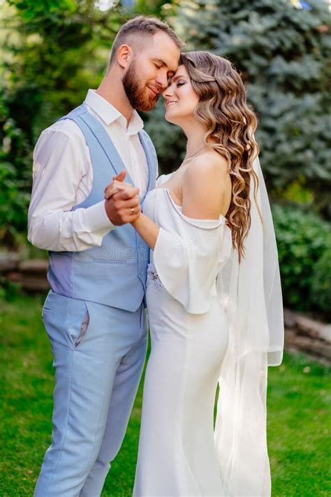 Walking Newlyweds In The Summer Garden Wedding Photo Shoot In The Park