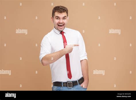 Happiness Man Toothy Smiling And Showing Finger At Copy Space Business