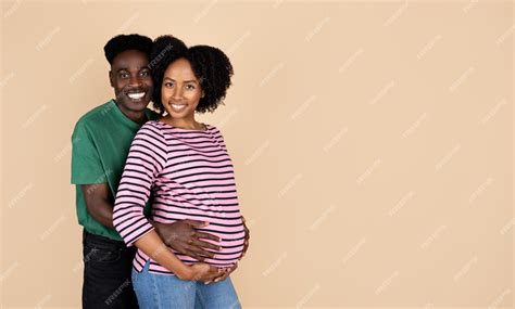 Premium Photo Glad Millennial African American Husband Hugging Woman