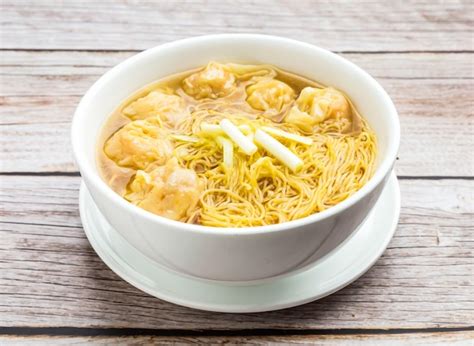Premium Photo Wonton Noodles Soup Served In Dish Isolated On Wooden