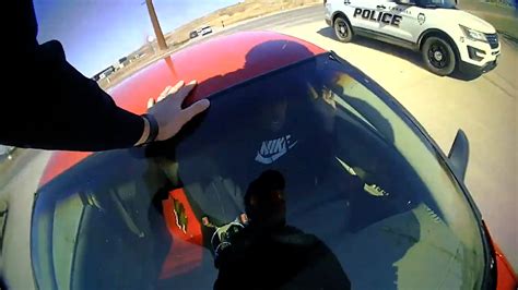 Officer Clings To The Hood Of Suspects Fleeing Car New Video Shows