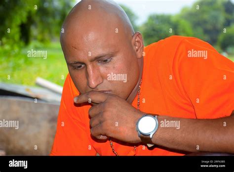 Cute Bald Model Wearing Orange T Shirt Smiling Joyful Guy Summer