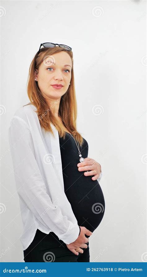 Young Pregnant Woman Holds Her Hands On Her Swollen Belly Love Concept