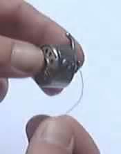 Image result for How to Remove Thread From Bobbin