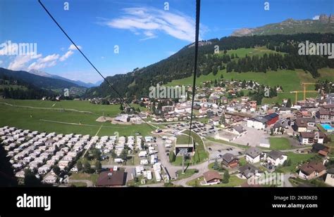 Cable car ride in Switzerland. The cable car descends into the valley ...