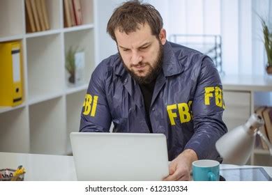 Image result for Federal Agent Typing On a Computer