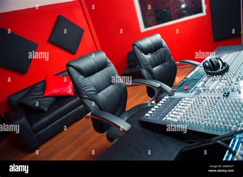 Classy professional recording studio setup, large desk with mixing ...