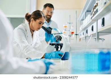 Image result for Looking through Microscope