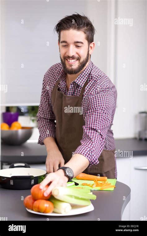 young man cooking Stock Photo - Alamy