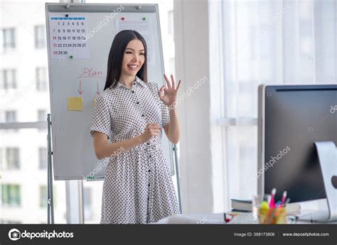 Young sign language interpreter conducting a webinar for deaf people ...
