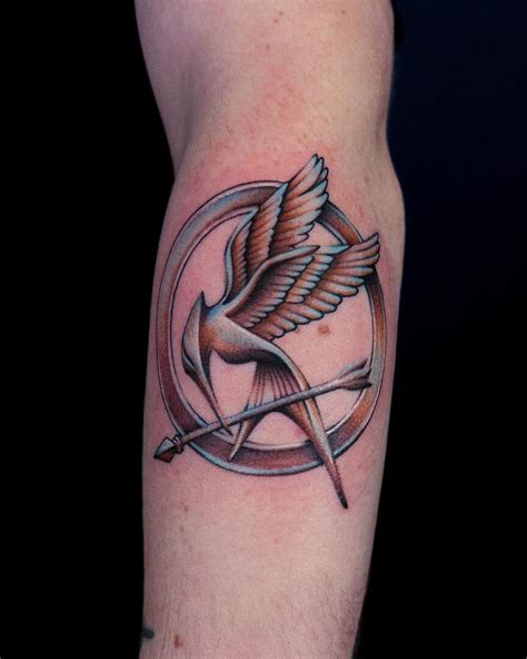 22 Incredible Hunger Games Tattoo Ideas Fit For Die-Hard Fans
