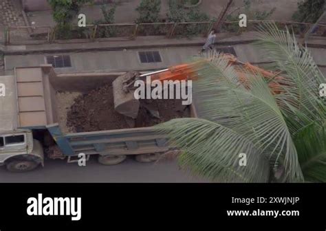 Image result for Indian Man Using Soil Compaction Machine