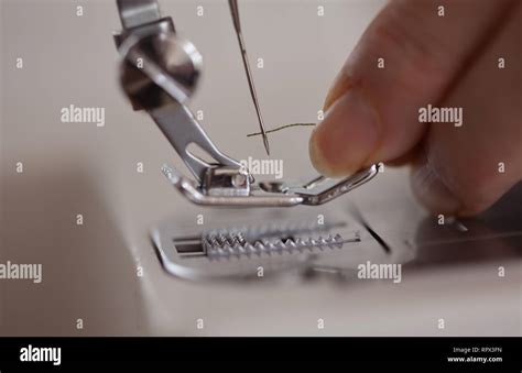 Image result for Threading a Sewing Machine Needle