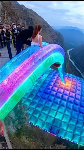 Colorful Cliff Airbag goes crazy! 😱🌈 One bounce, she flies! #cliffactivity #cliffslide #rdswth