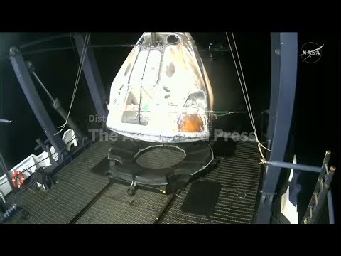 Recovery ship picks up capsule with four astronauts in Pacific Ocean