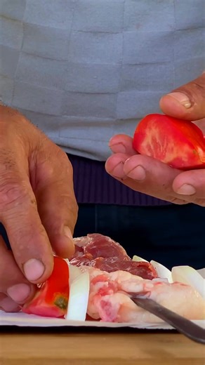 Tender meat and veggies cooked in foil over open flames, creating a rustic outdoor feast. #OutdoorCooking #FoilPacketMeal #OpenFireCooking #Cooking | Faraway Village Family