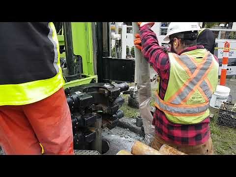 Extruding Soil Sample During Sonic Drilling