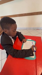 Kye, our grade 2 student rounding numbers to the nearest ten. | Brookside International School