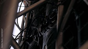 Theater lighting technician electric engineer adjusting focus of lighting elements backstage. Spotlights in the theater. Behind the scene