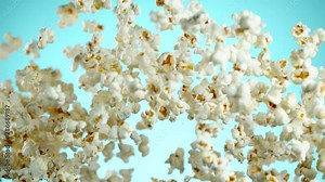 Super slow motion of falling popcorn on coloured background. Filmed on high speed cinema camera, 1000fps.