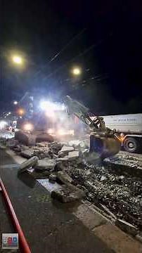 Komatsu HB 215 Hybrid Loads Concrete Debris