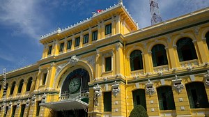 HO CHI MINH CITY, VIETNAM - JANUARY 18, 2016: Saigon Central Post Office designed by Gustave Eiffel. Local people and tourist take a sight seeing at Post Office Stock Video