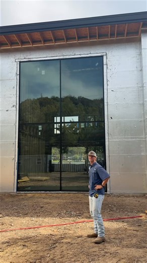 Jenkins Design Build on Instagram: "A window that redefines the view, and the vision. This 43-foot-tall curtain wall by @LuxView opens up the heart of our Lake Austin build, framing the ultimate living room moment: panoramic lake views and a sculptural spiral staircase that turns every glance into an experience. - — #LakeAustinBuild #LakeAustinHome #CurtainWallWindow #SpiralStaircaseDesign #ModernLuxuryHome #CustomHomeBuild #AustinArchitecture #TexasHomes #LuxuryLiving #LakeViewLiving #LuxViewWi