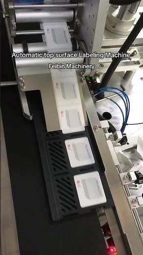Automatic top surface labeling machine #labelingmachinemanufacturer #labelingmachine #toplabeling