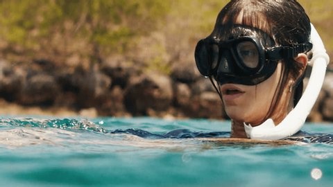 clip-3985914489-close-portrait-woman-freediver-swimming-mask-underwater