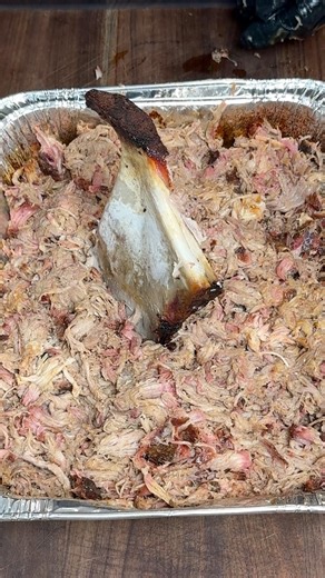 Elevate your pulled pork with this smoked, Dr. Pepper pulled pork recipe! This method, which involves marinating an entire pork butt in Dr. Pepper, tenderizes and flavors the pork like no other. This is one of my favorite methods to ensure juicy and delicious pulled pork every single time. | Ninjacue