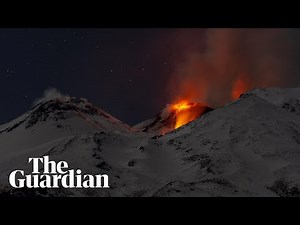 Snow-covered Mount Etna spews lava and ash as it erupts