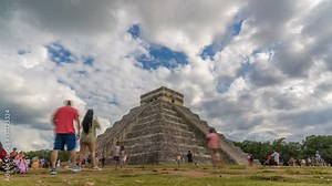 Time lapse of clouds and people passing El Castillo Pyramid, Chichen Itza, UNESCO World Heritage Site, Yucatan, Mexico