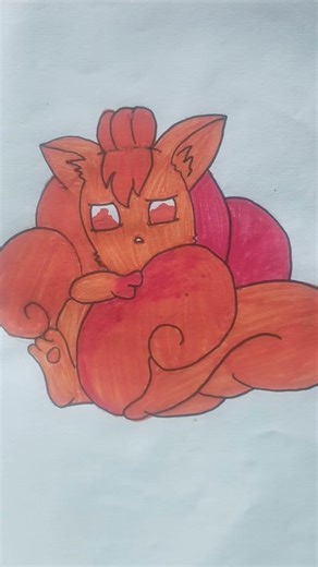 Pokémon Vulpix, a small fox-like creature known for its multiple curly tails.
