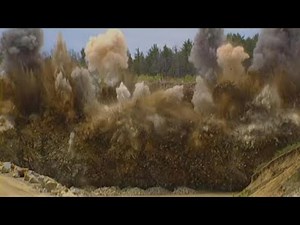 Blasting Crew Loading Explosives And Blowing Up Solid Rock At A Quarry from House Construction Ahead