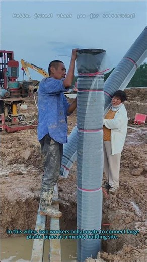 Pipe Laying: Workers Connect Pipes in Muddy Site