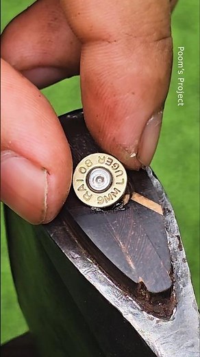 The art of axe handle installation decorated with 9mm shell casings #craftsmanship