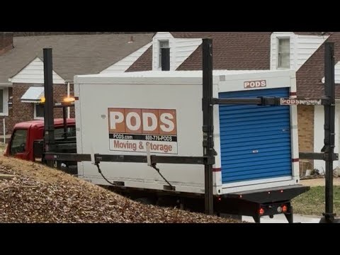 Pods truck loading a Pods pod onto the Pods truck