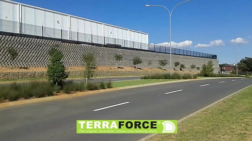 Completed near vertical L11 Terraforce® hollow core retaining block wall makes space for a new warehouse in Johannesburg, ZA. Blocks manufactured by Remacon Products, contact 011 393 5504 or click https://www.terraforce.com for more information. | Terraforce Retaining Walls