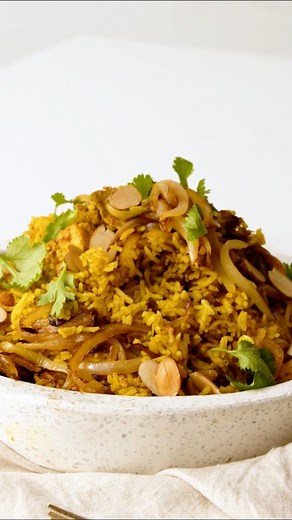 This isn't just any chicken and rice dish. This flavour-packed biryani is cooked in a rice cooker, resulting in tender chicken and perfectly fluffy, spice-infused rice! Get the recipe in the comments or Google “Taste rice cooker chicken biryani”. | Taste.com.au